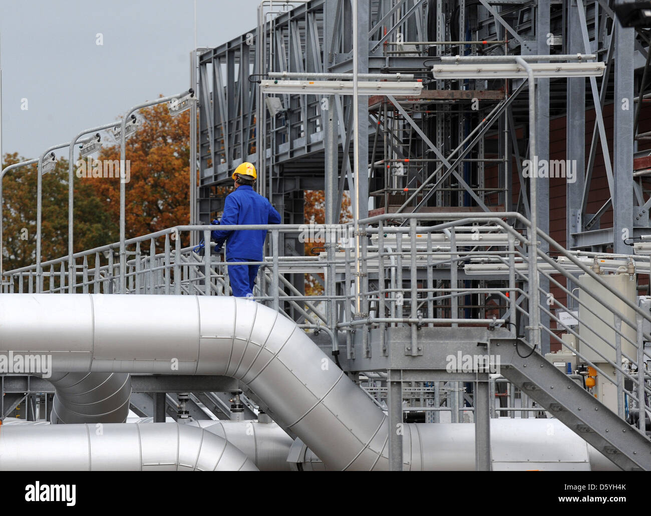 A worker walks past a gas pipeline of the gas reservoire Etzel (ESE) in ...