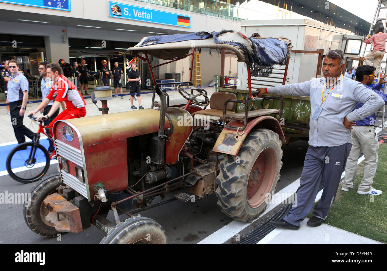 A track worker stands beside his tractor in front of the teamgarage of ...