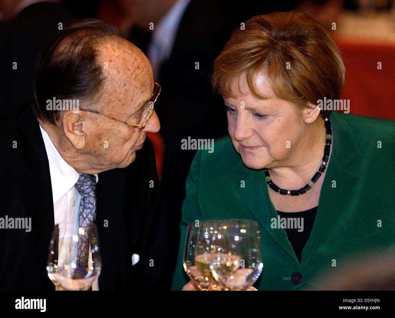 German chancellor Angela Merkel talks to former German exterior ...