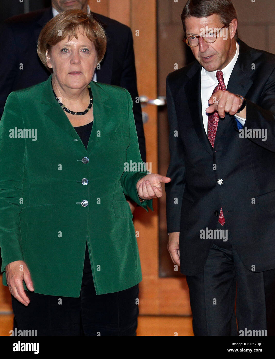 German chancellor Angela Merkel and the head of trhe German economy ...
