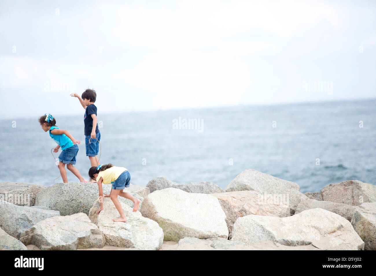 8 9 standing on rock by sea hi-res stock photography and images - Alamy