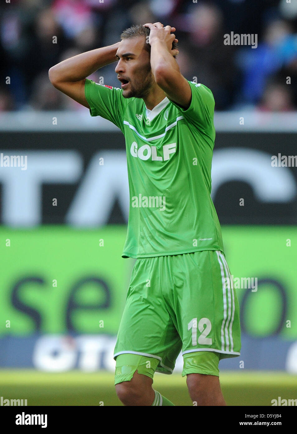 Wolfsburg's Bas Dost grabs his head during the German Bundesliga match ...