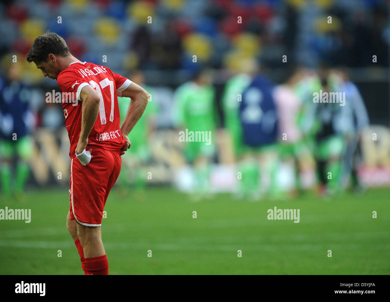 Duesseldorf's Andreas Lambertz leaves the pitch after the German ...