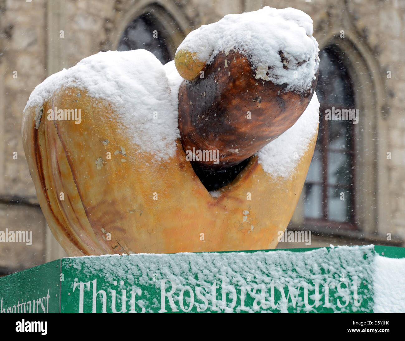 A bratwurst sign is covered in snow in Weimar, Germany, 27 October 2012 ...