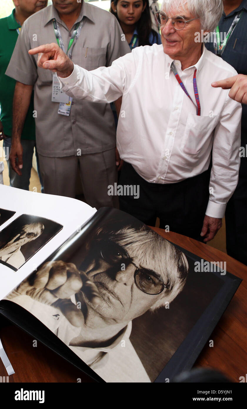 British Formula One Boss Bernie Ecclestone receives a large photo book ...