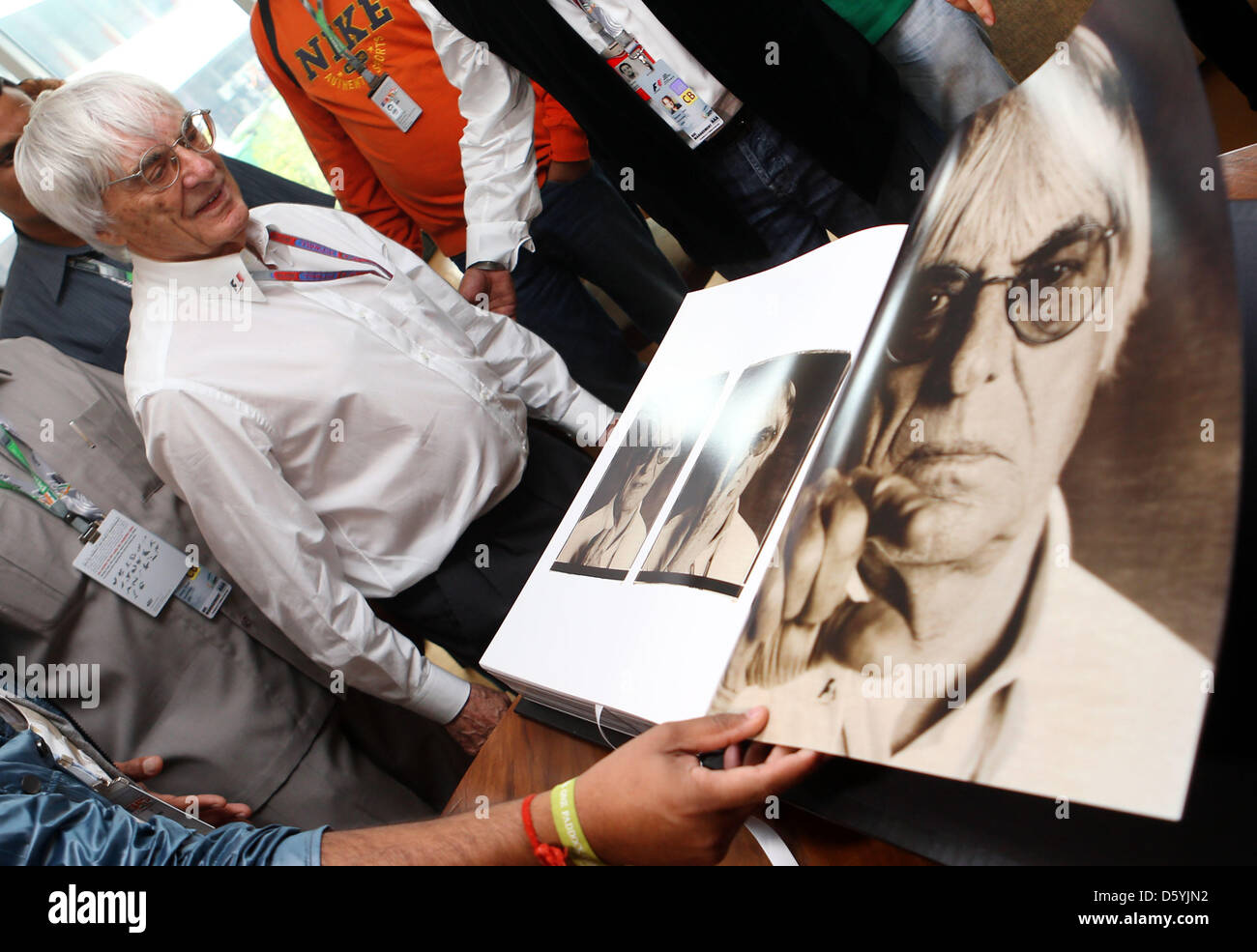 British Formula One Boss Bernie Ecclestone receives a large photo book ...