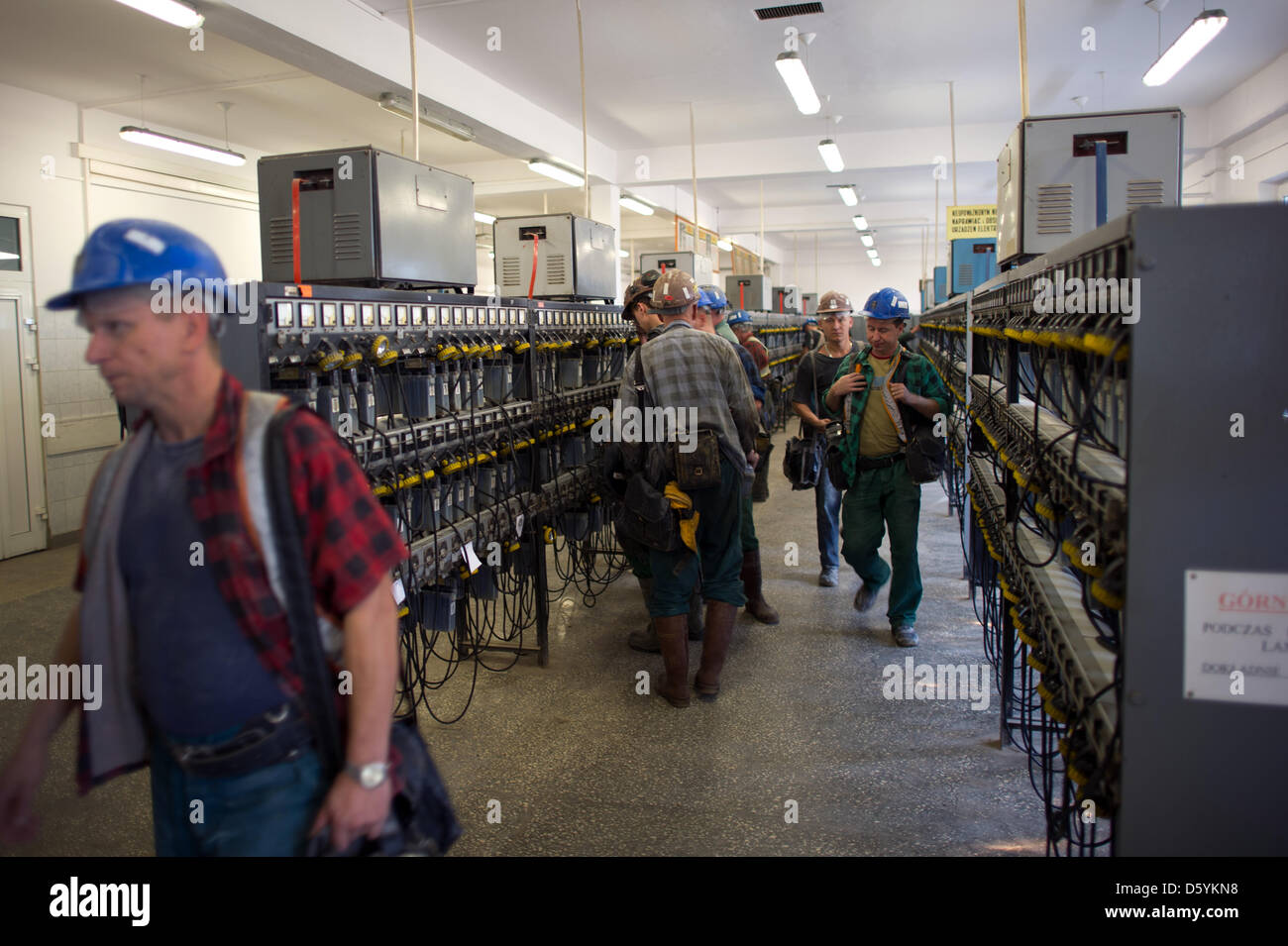 Miners walk into the change house after a shift at the KGHM Polska ...