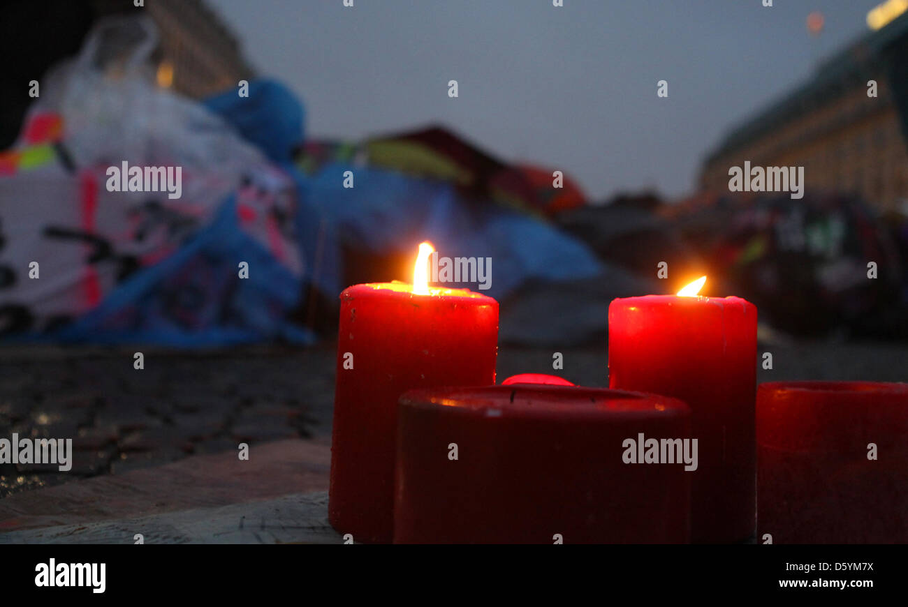 Candles are lit up as activists and asylum seekers demonstrate in ...
