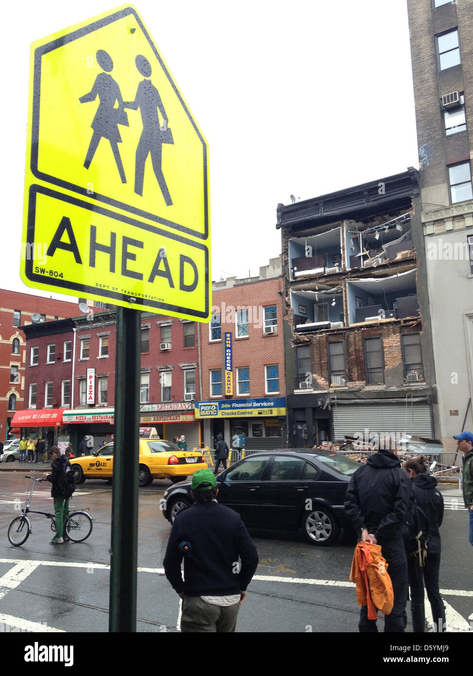 The collapsed facade of an apartment building is pictured in Lower ...