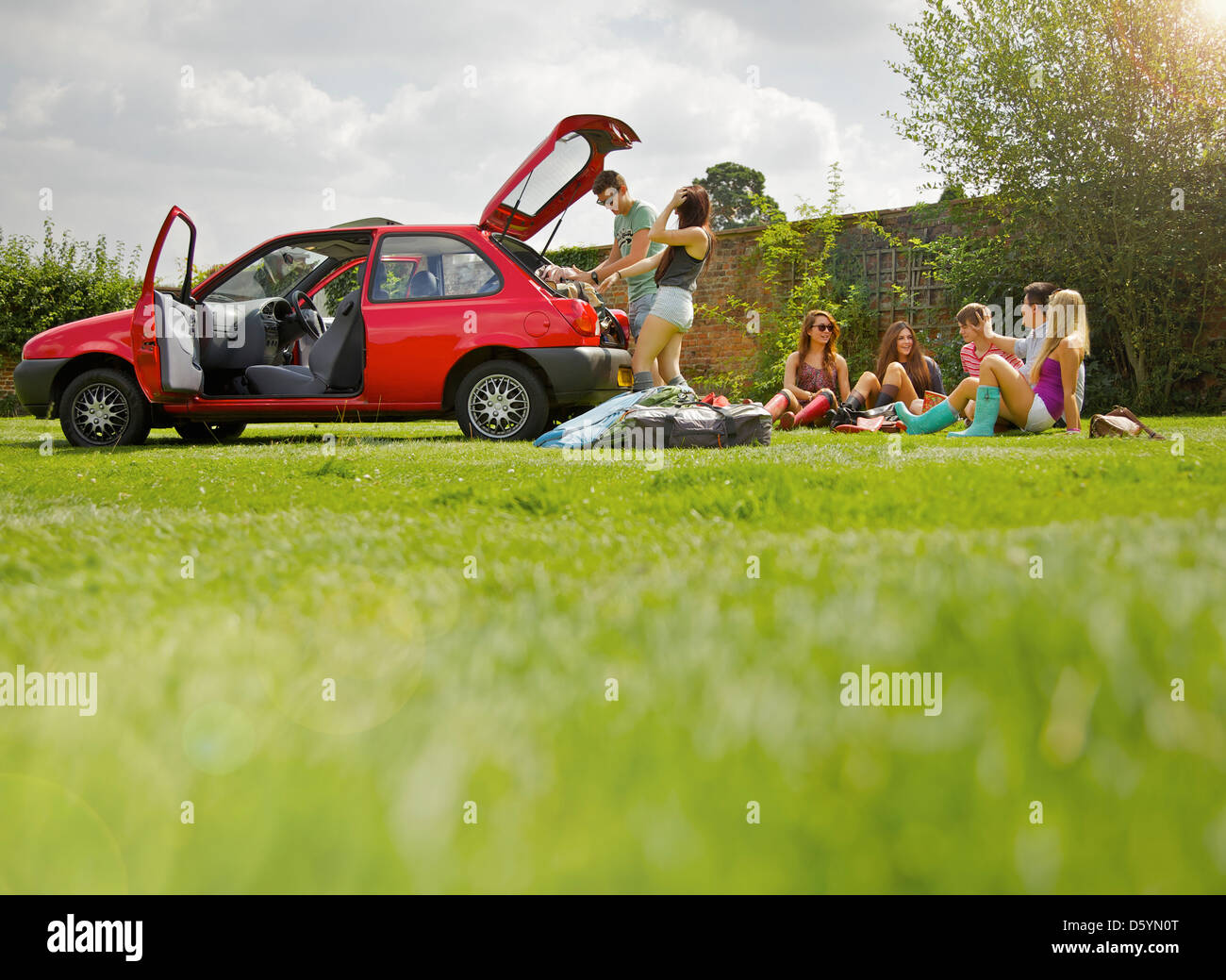 Girl loading luggage into car hi-res stock photography and images - Alamy