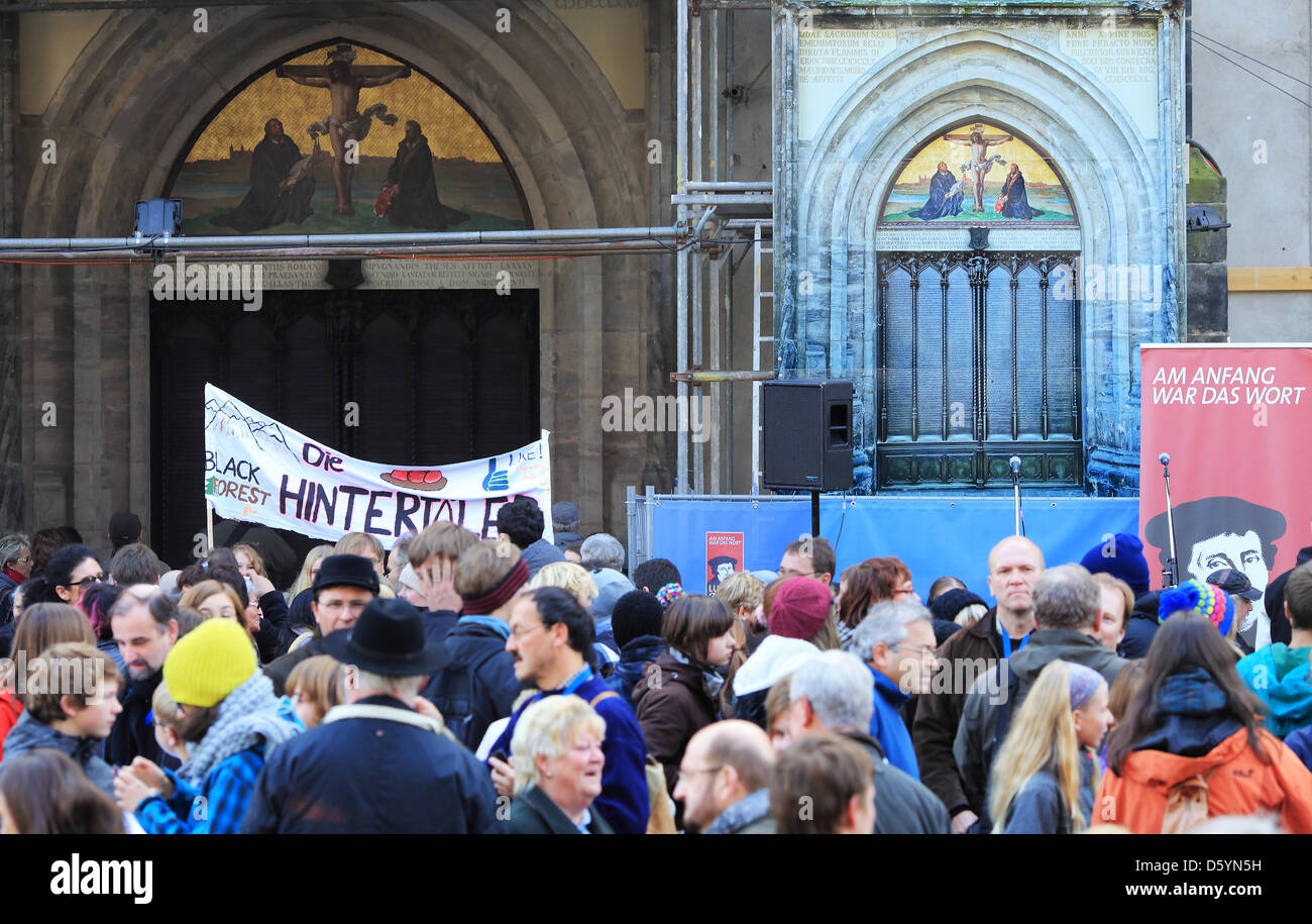 Numerous people celebrate Reformation Day in front of the door of All ...