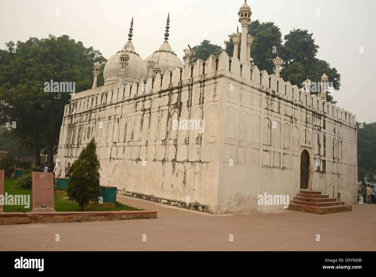 The white marble three dome mosque of the Moti Masjid on the grounds of ...