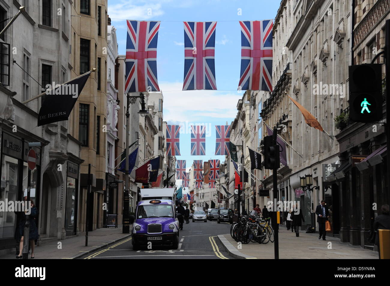 A cab stands in a street decorated with British flags in London, Great ...