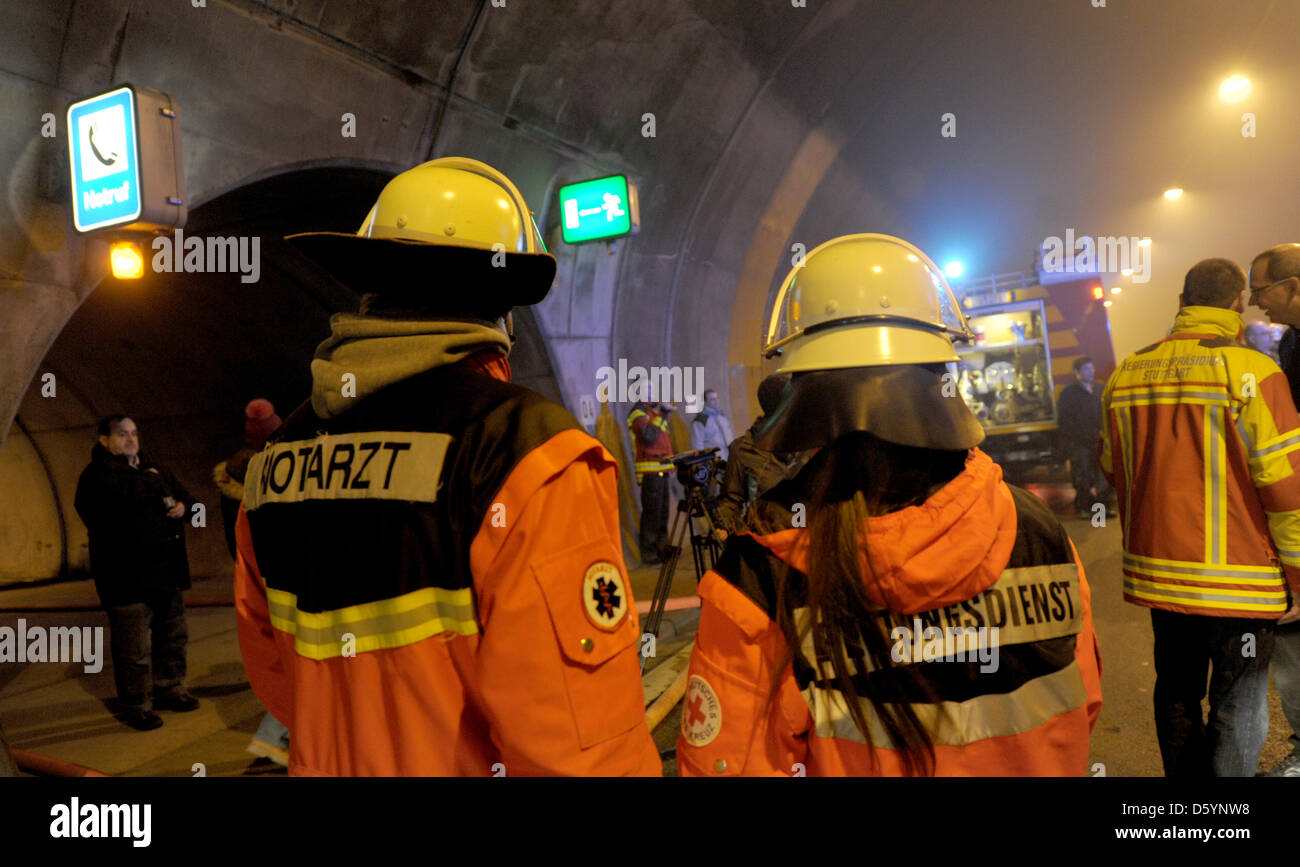 Firemen attend a disaster management drill inside the Engelberg Tunnel ...
