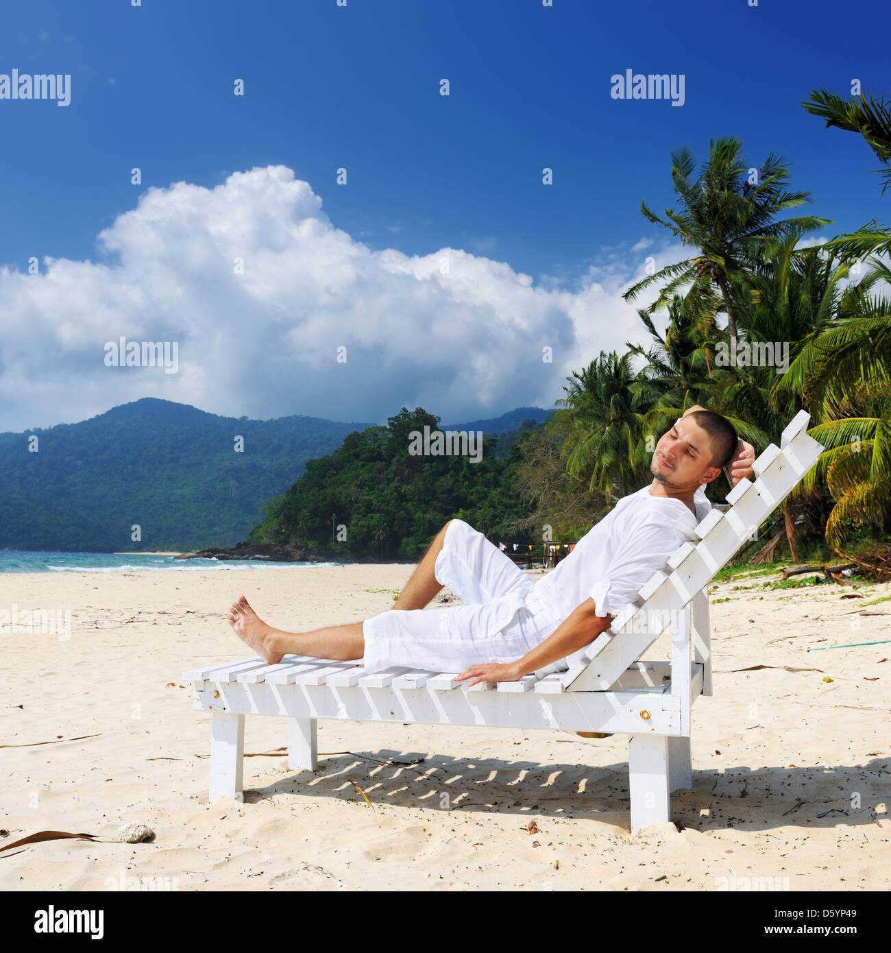Man relaxing on a beach Stock Photo - Alamy