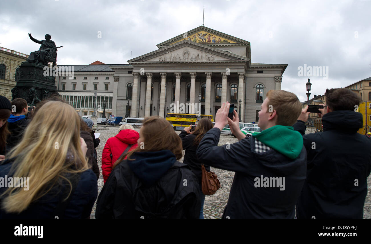 People photograph the Bavarian State Opera at Max-Joseph Square in ...
