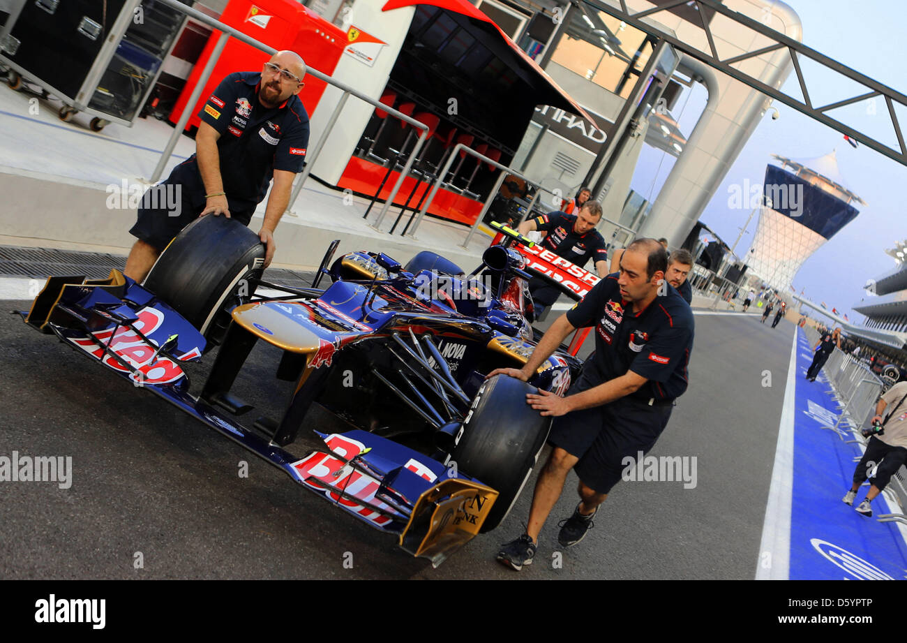 Mechanics push back the racing car of French Formula One driver Jean ...