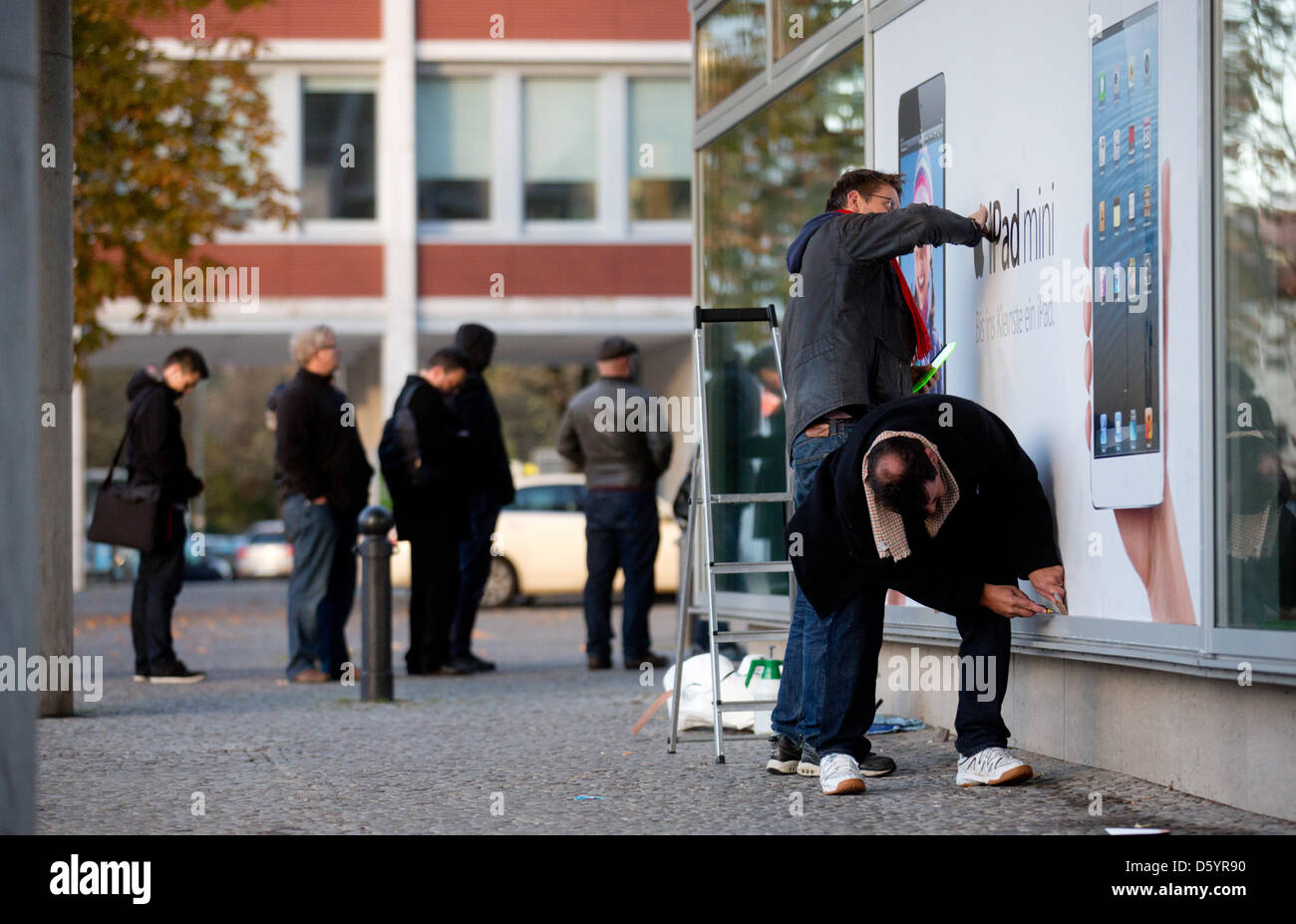 A large advertising poster for the new iPad mini is stuck to a shop ...