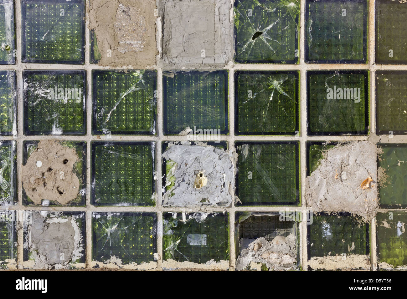 Broken green glass blocks background Stock Photo - Alamy