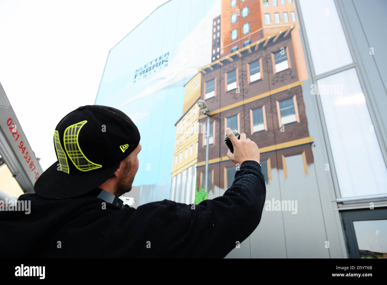 Graffiti artist Rene Turrek poses at a building with Graffiti in ...