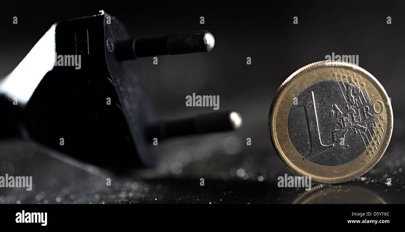 A Euro coin and a plug are pictured in Hamburg, Germany, 28 OCtober ...
