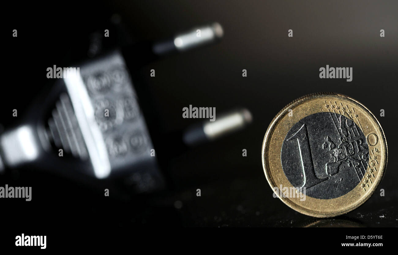 A Euro coin and a plug are pictured in Hamburg, Germany, 28 OCtober ...