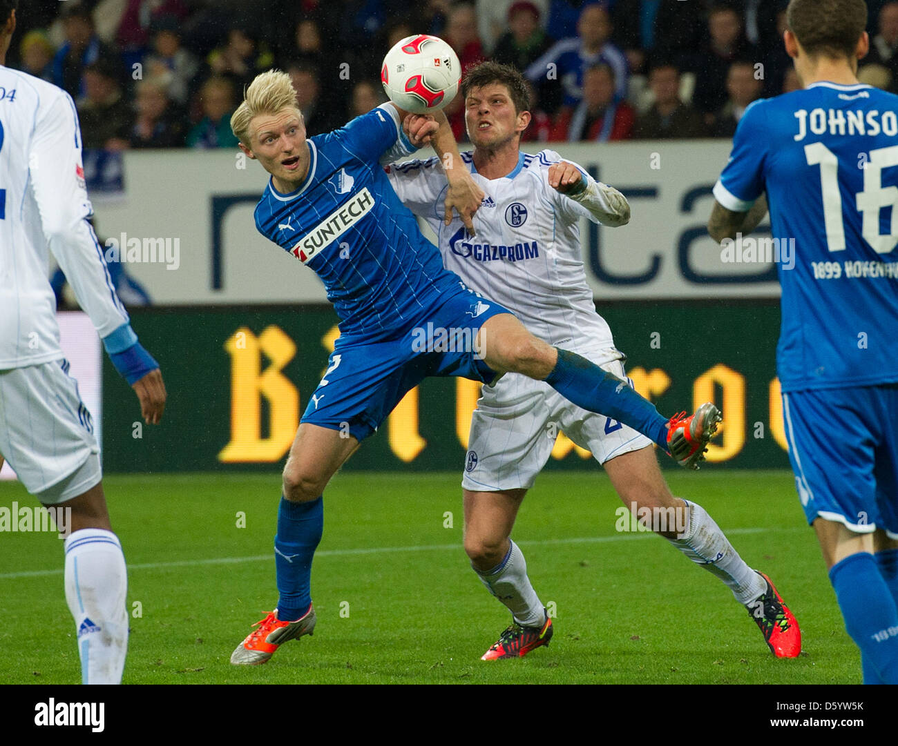 Schalke's Klaas-Jan Huntelaar (R) fights for the ball with Hoffenheim's ...