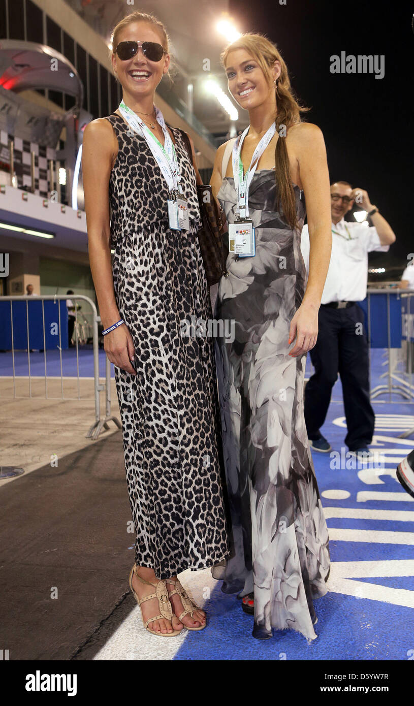 Girls pose in the pit lane after the qualification session at the Yas ...