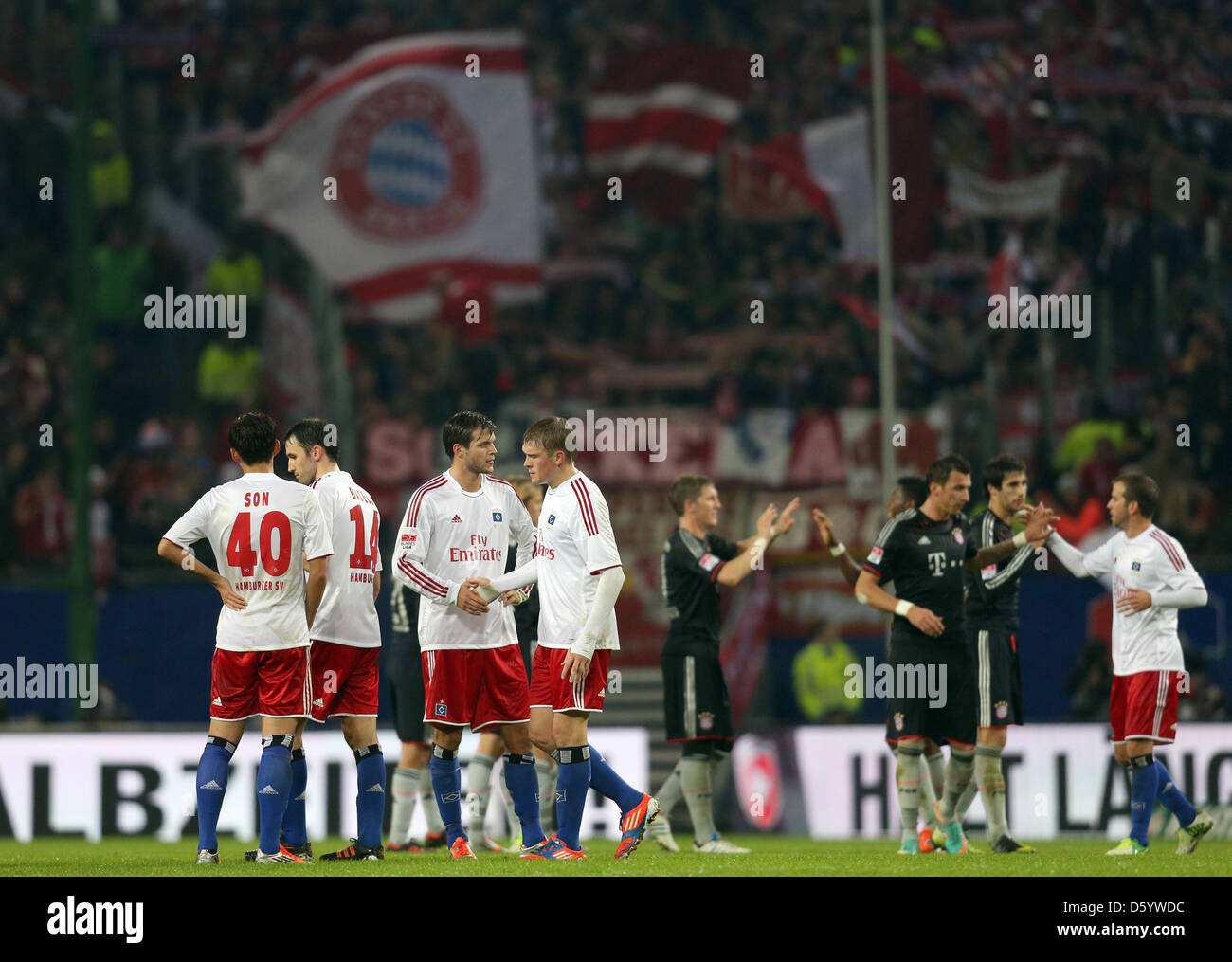 Hamburg's players stand on the pitch after the German Bundesliga soccer ...