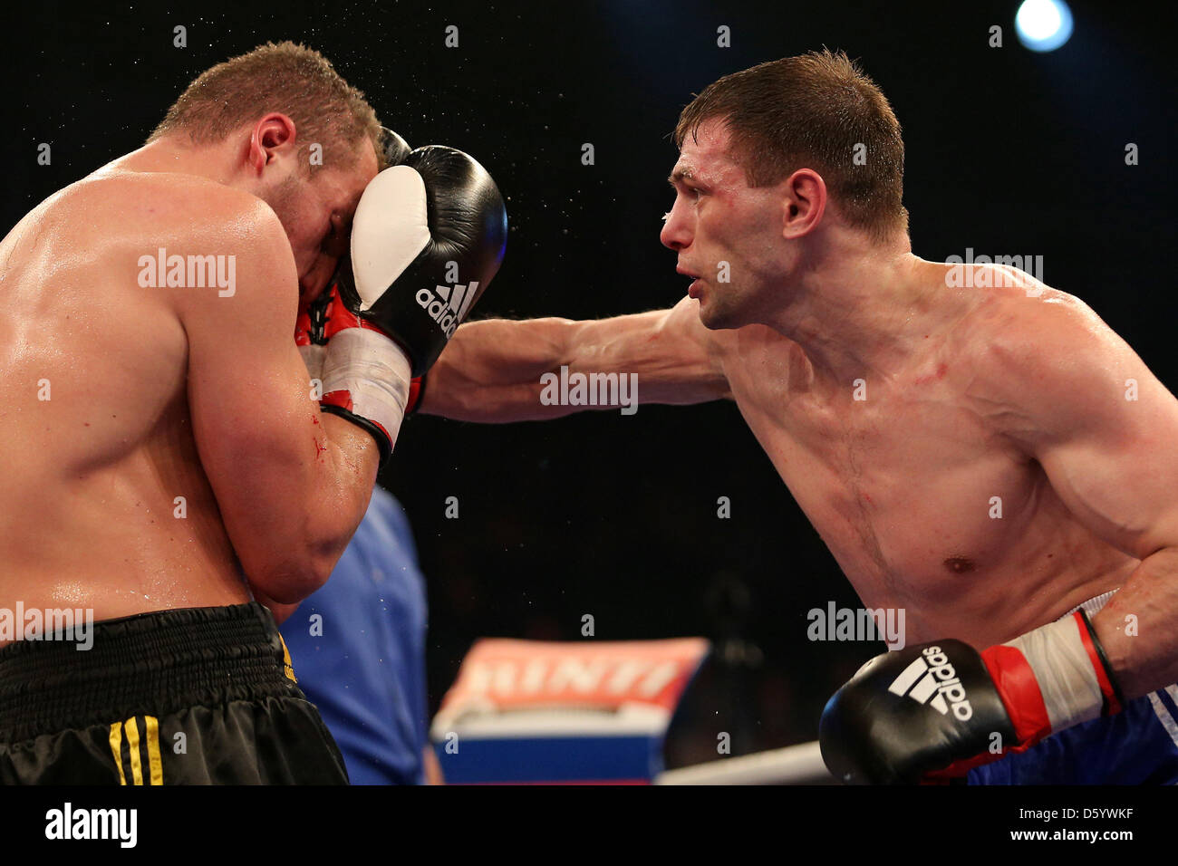 Russian light heavyweight boxer Ivan Maslov (L) fights against German boxer Enrico Koelling at ...