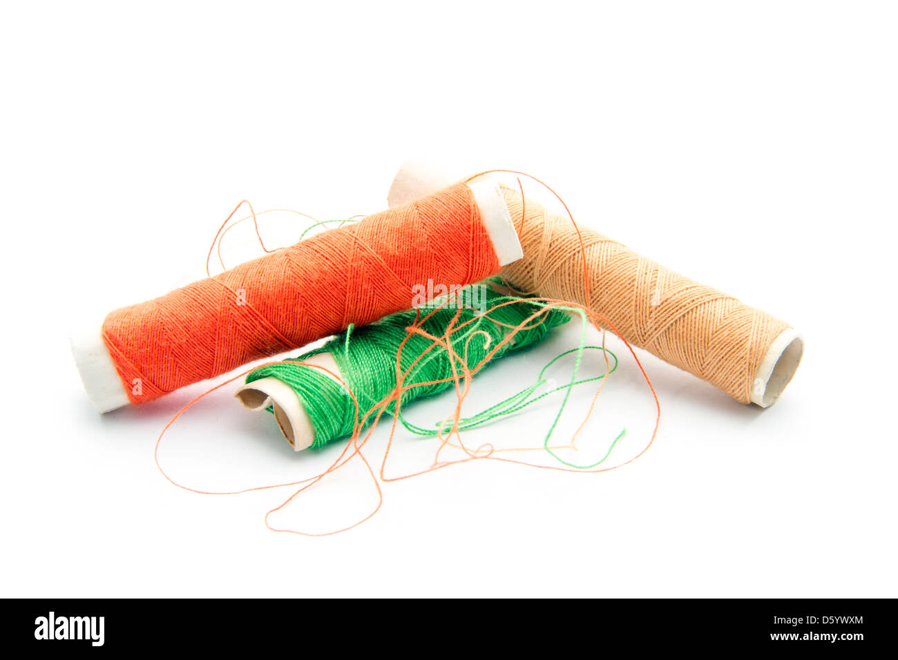 old thread spools isolated on white background Stock Photo - Alamy