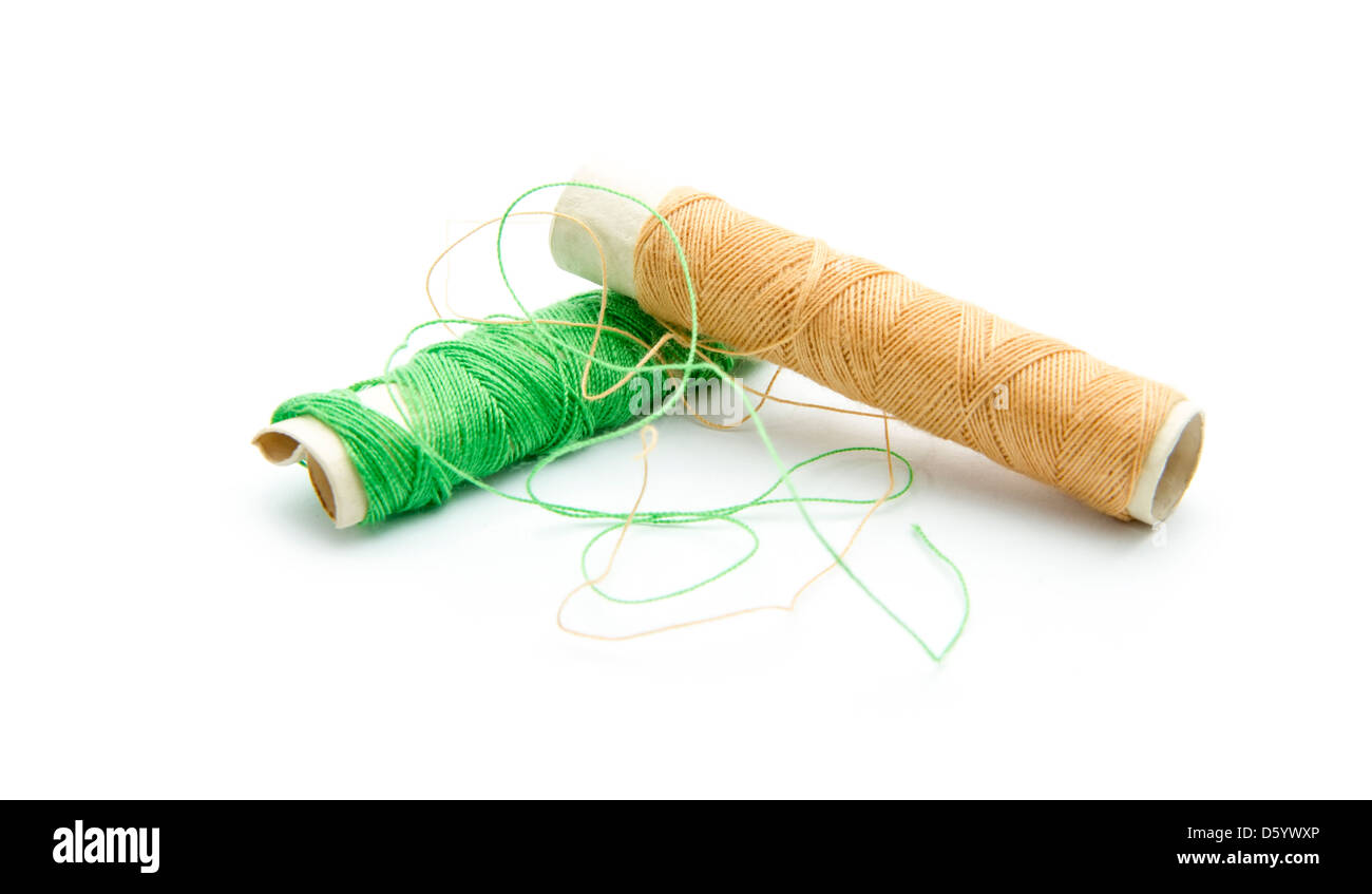 old thread spools isolated on white background Stock Photo - Alamy