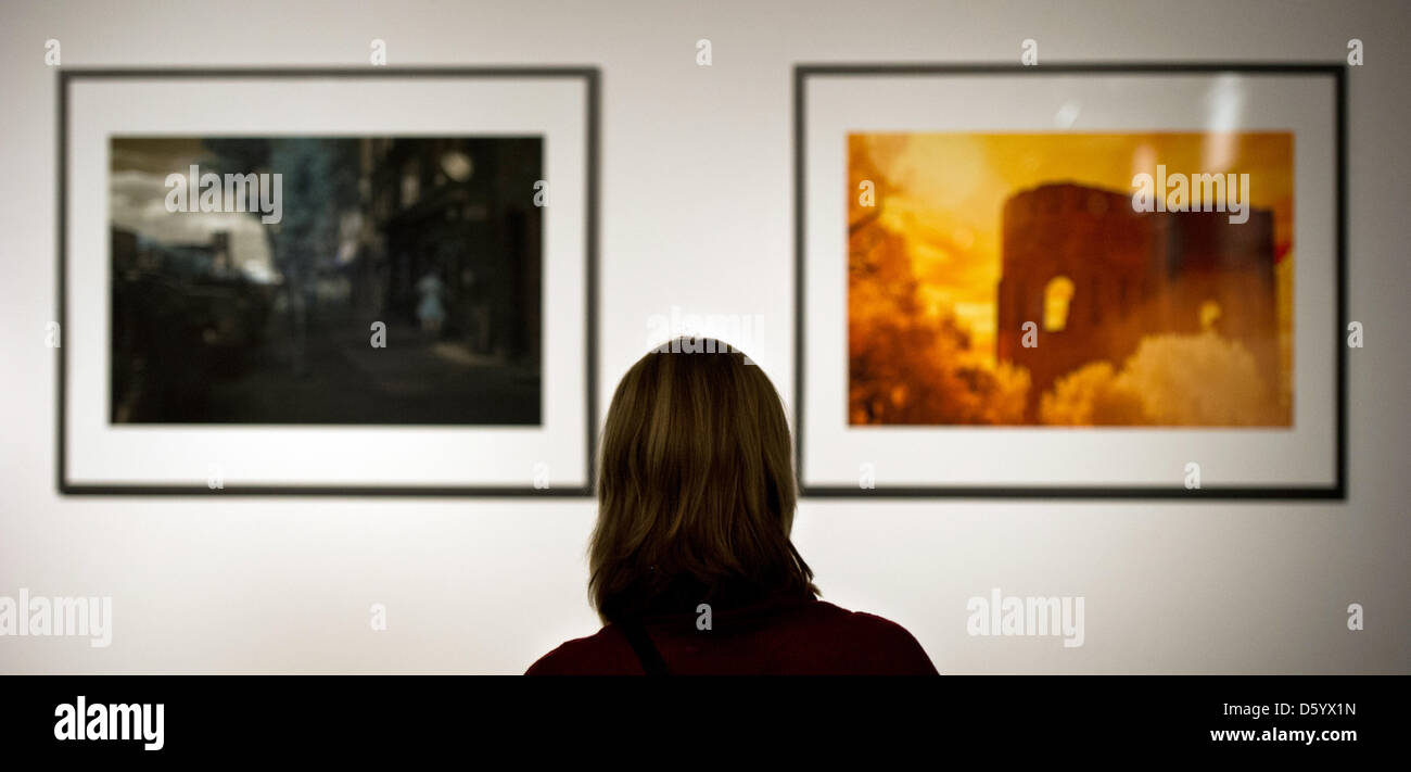 A visitor views photographs hi-res stock photography and images - Alamy