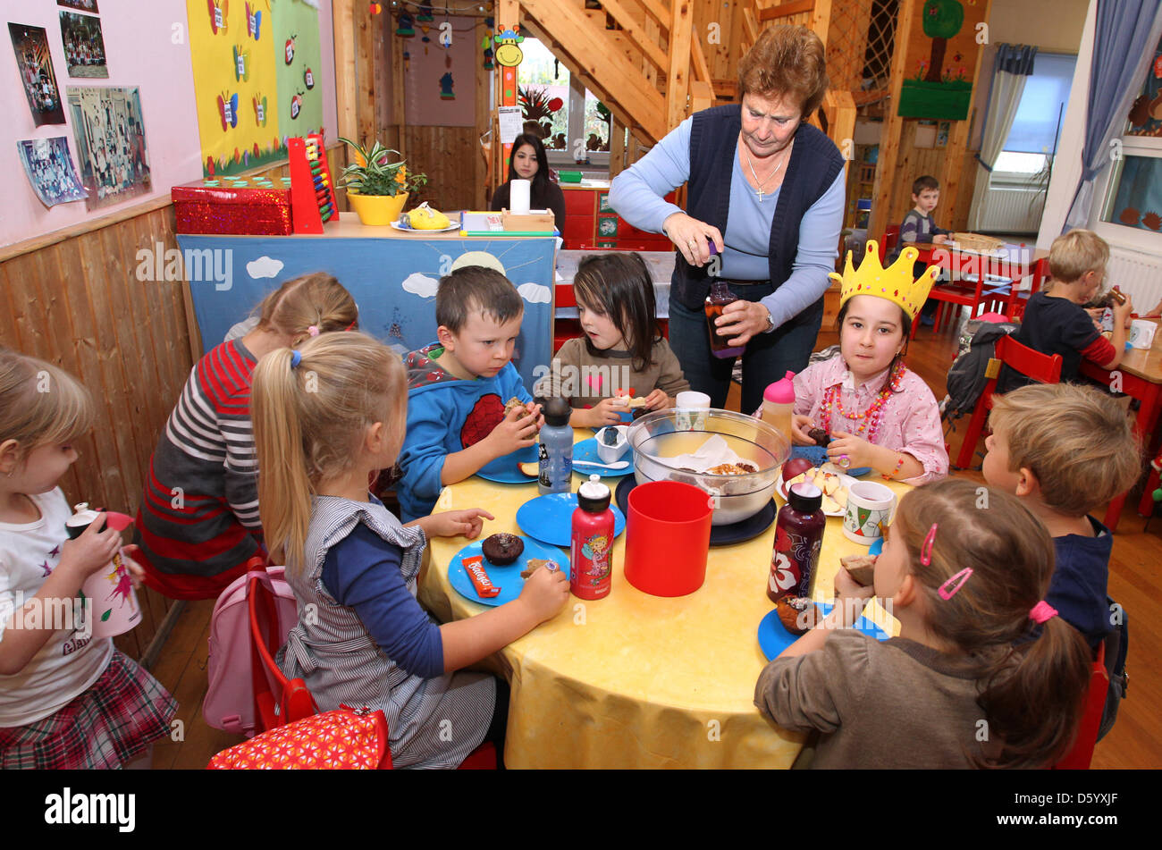 Children celebrate a birthday with kindergarten teacher Florence Landry ...