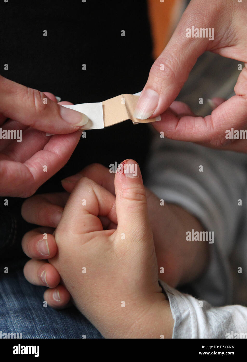Child band aid finger hi-res stock photography and images - Alamy
