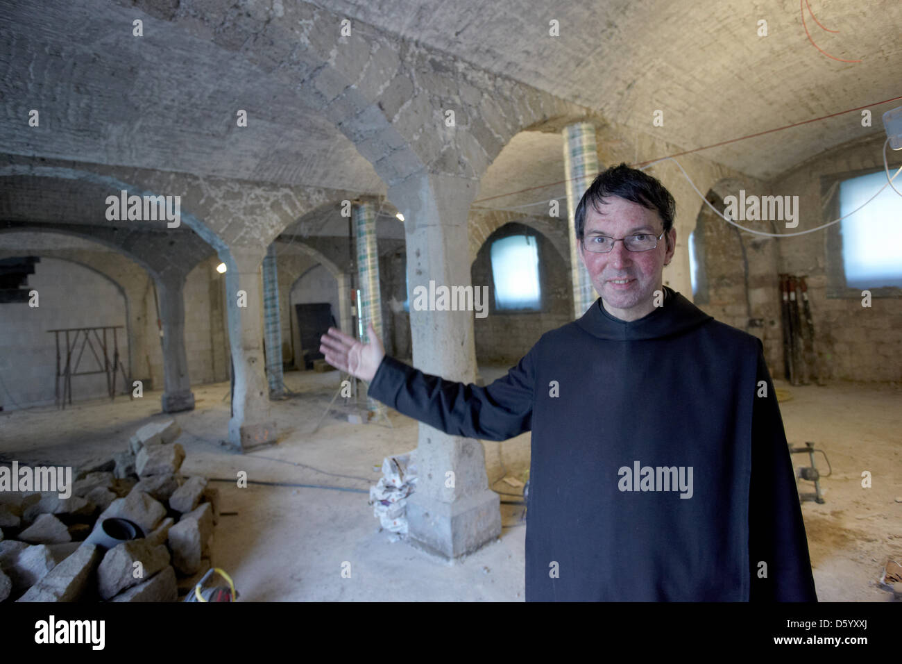 Benedictine monk Father Peter is pictured at the cowshed of the abbey ...