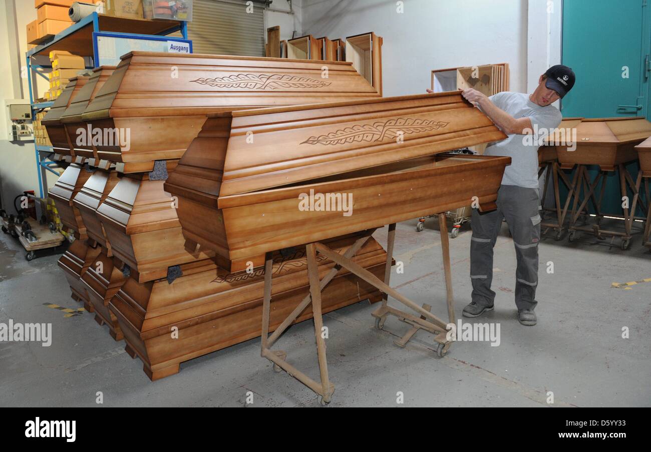 Staff members of the coffin factory Wurth work on coffins in Kappel ...