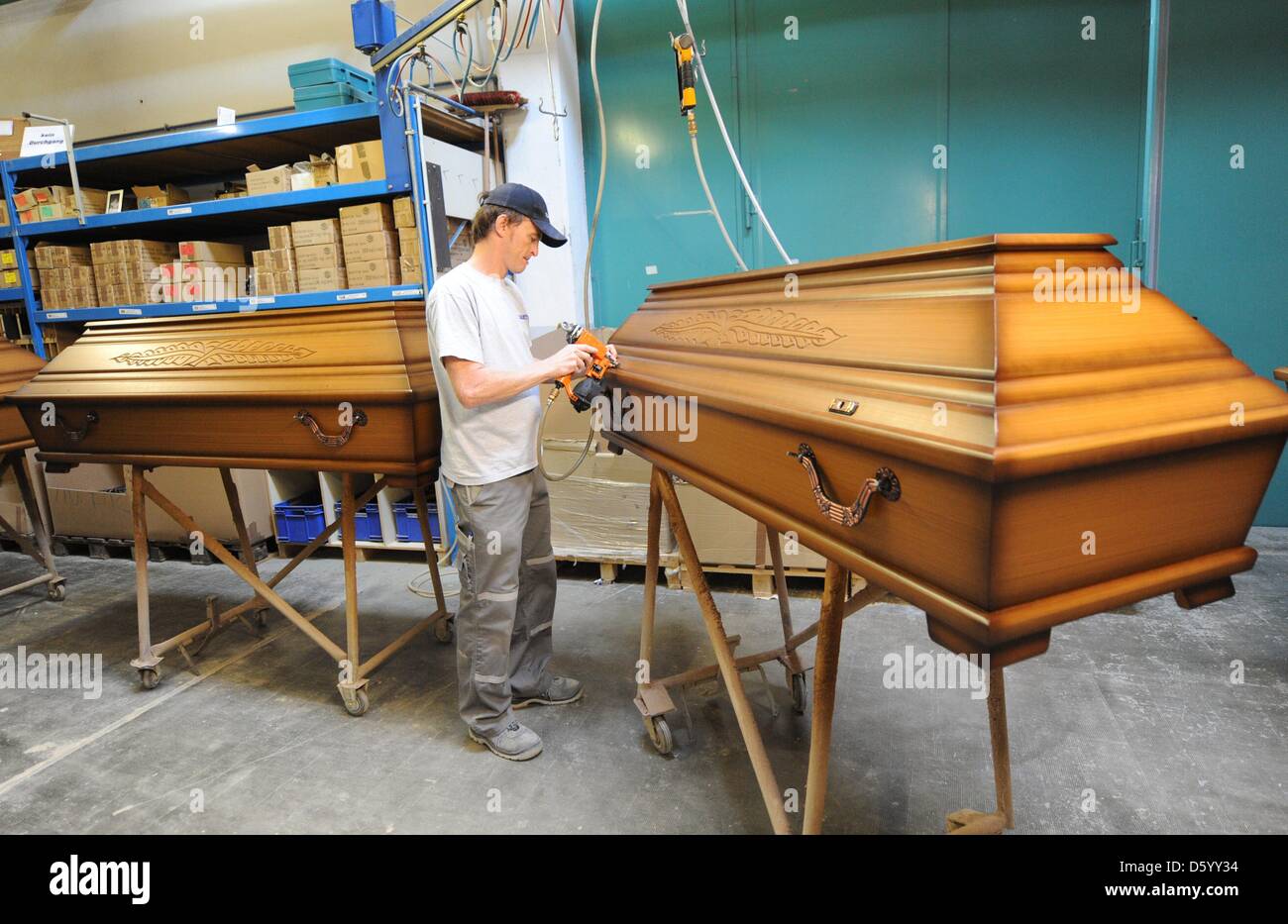 Staff members of the coffin factory Wurth work on coffins in Kappel ...