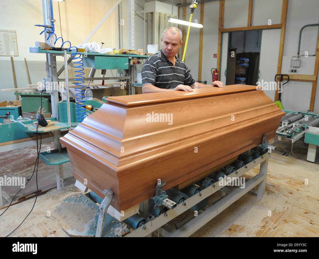 Staff members of the coffin factory Wurth work on coffins in Kappel ...