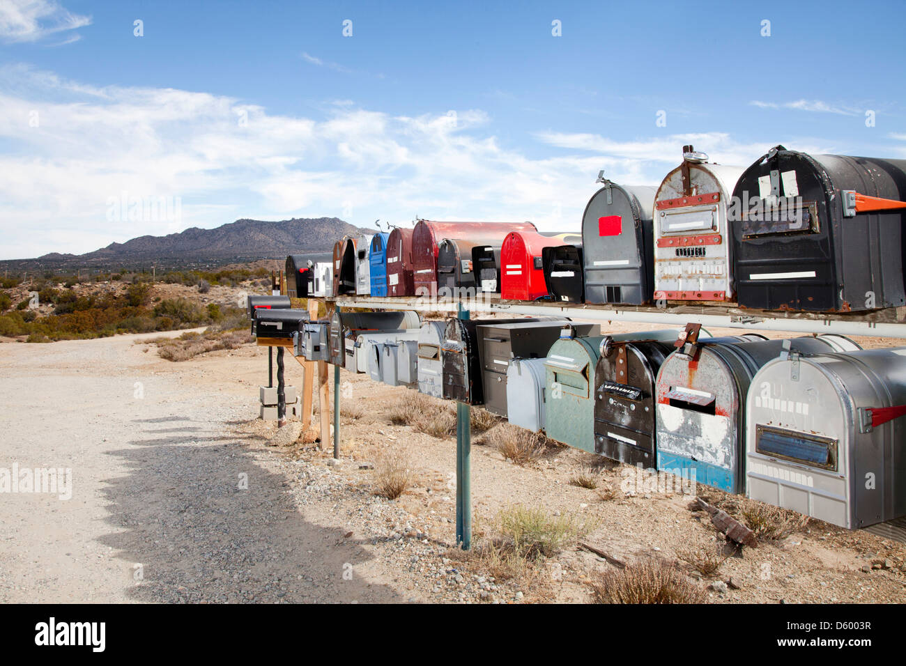 Rows of mailboxes in desert with mountains in background Stock Photo ...