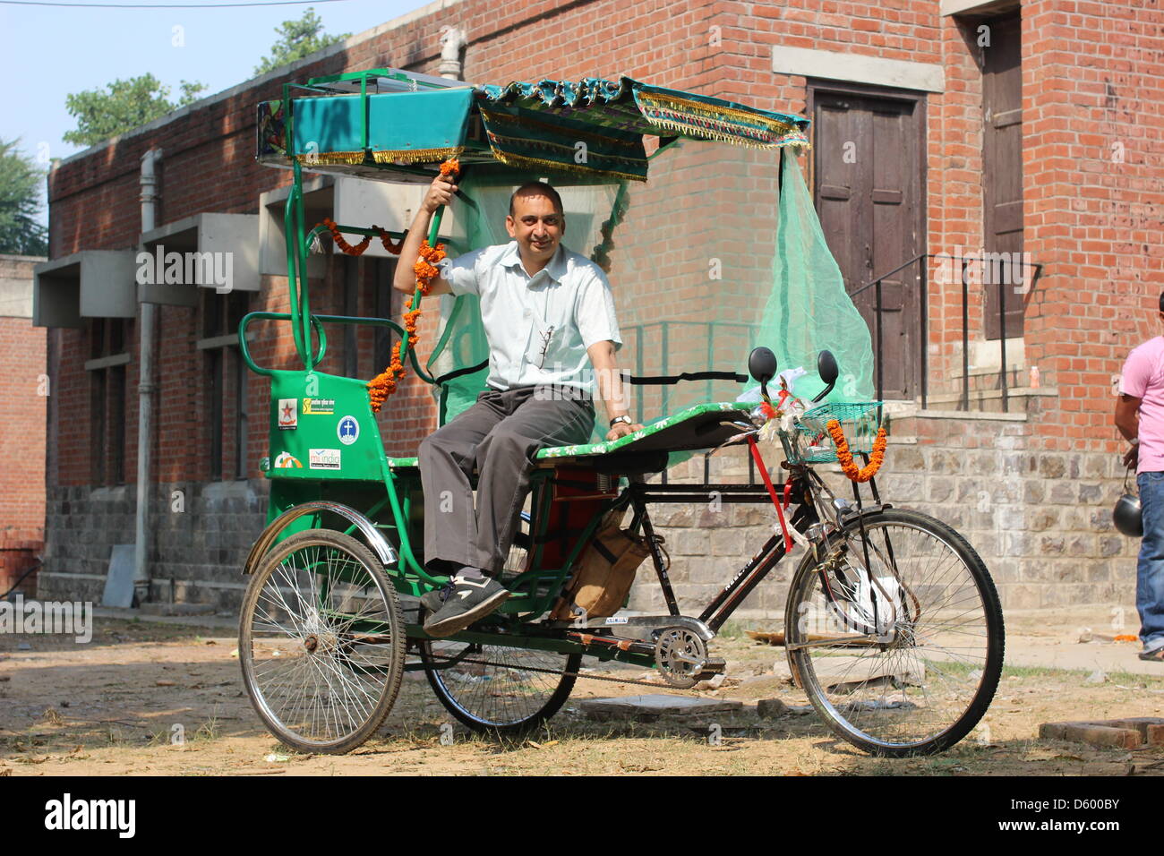 Director of the NGO Mother, Amod Kumar, sits on the prototype of a ...
