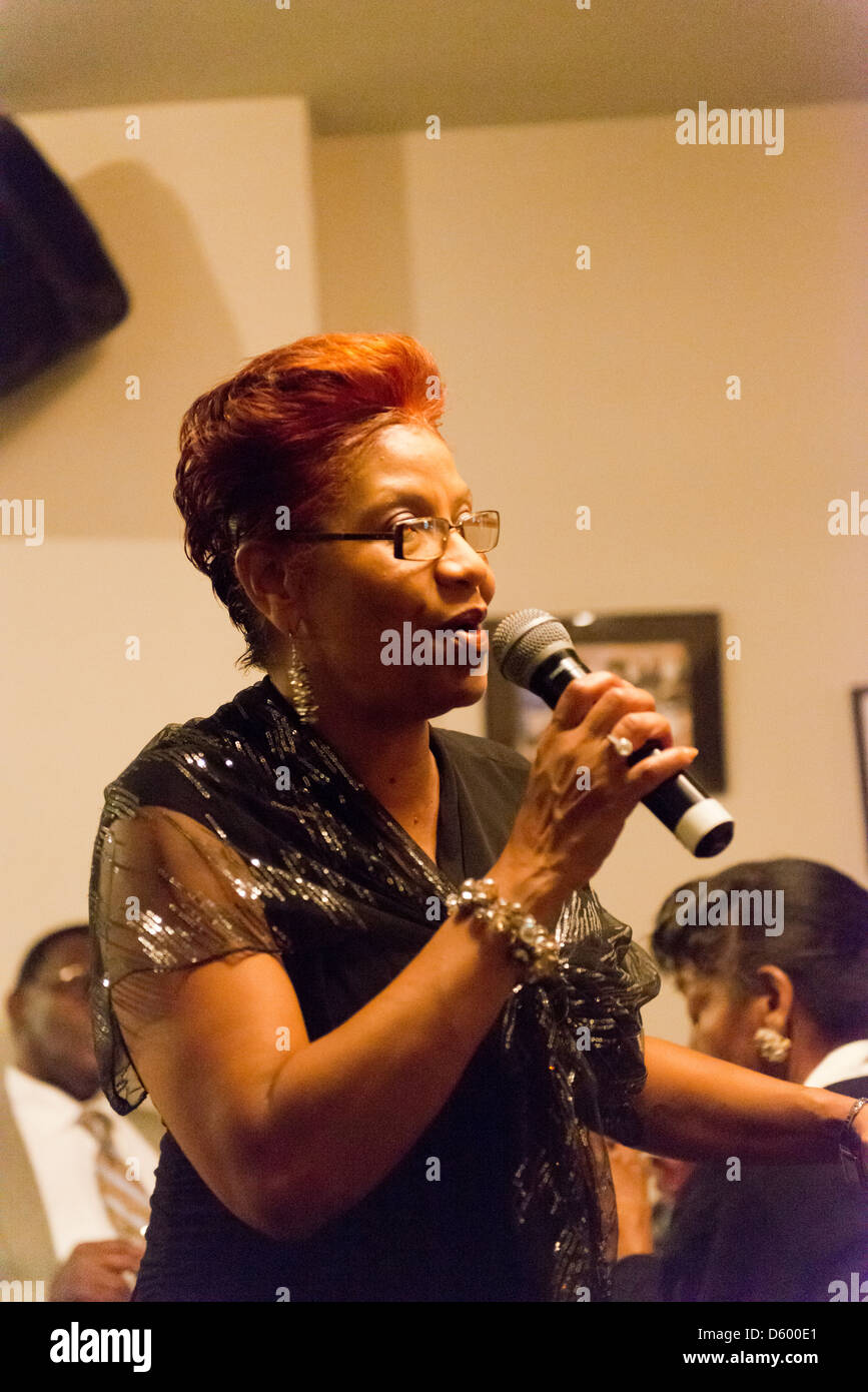 Woman singing for lunch-time diners in Silvia's Restaurant where they ...