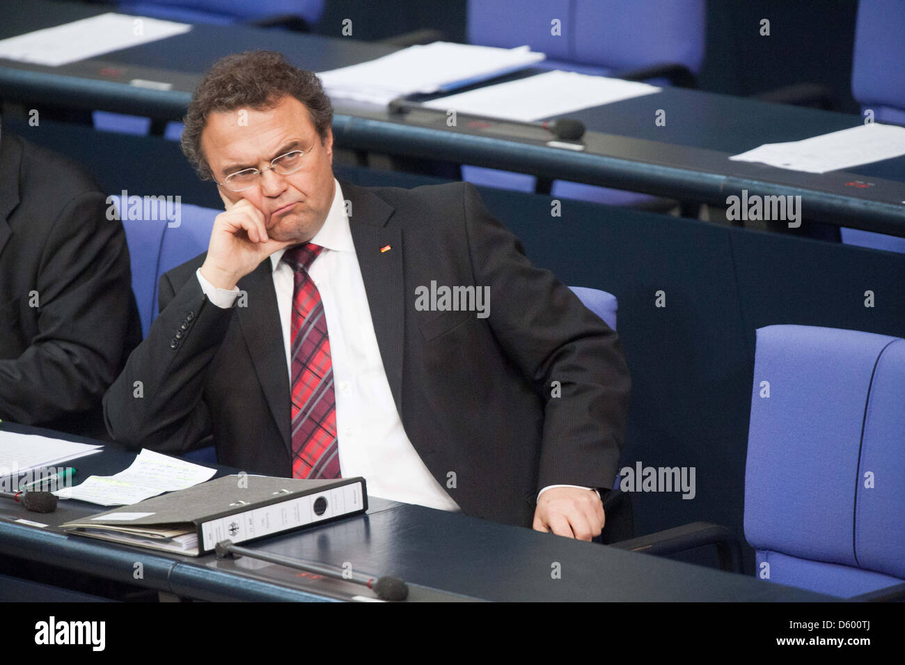 German Minister of the Interior Hans-Peter Friedrich listens during a ...