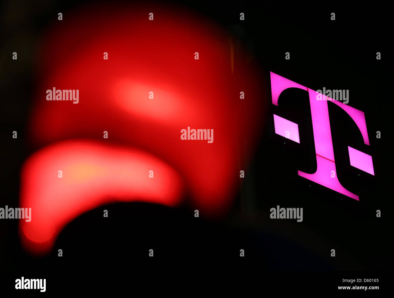 A red light is lit up next to the Telekom logo in Duesseldorf, Germany ...