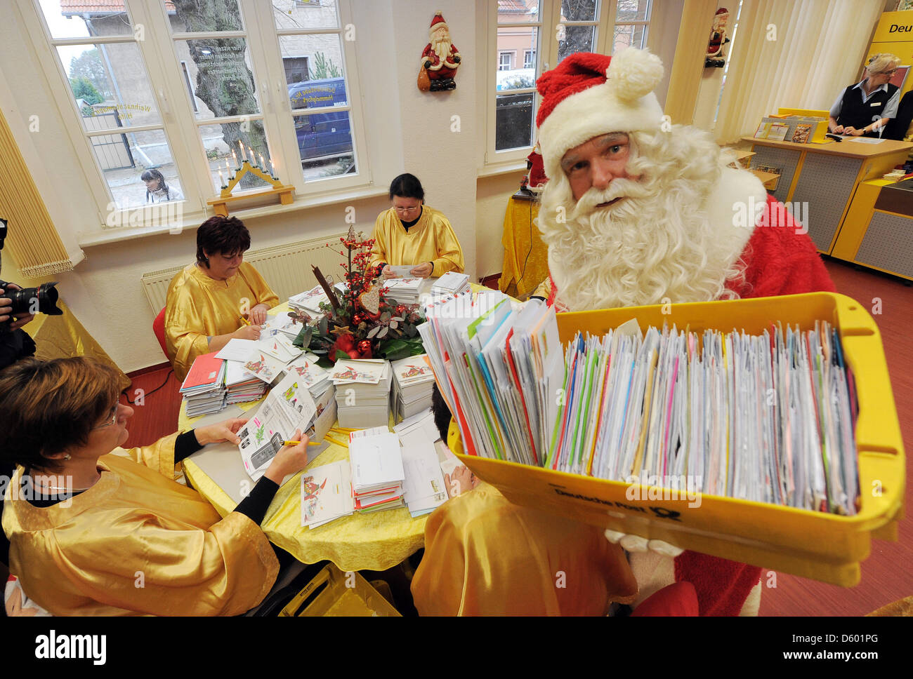 Santa Claus visits the Christmas Post Office where his helpers are ...