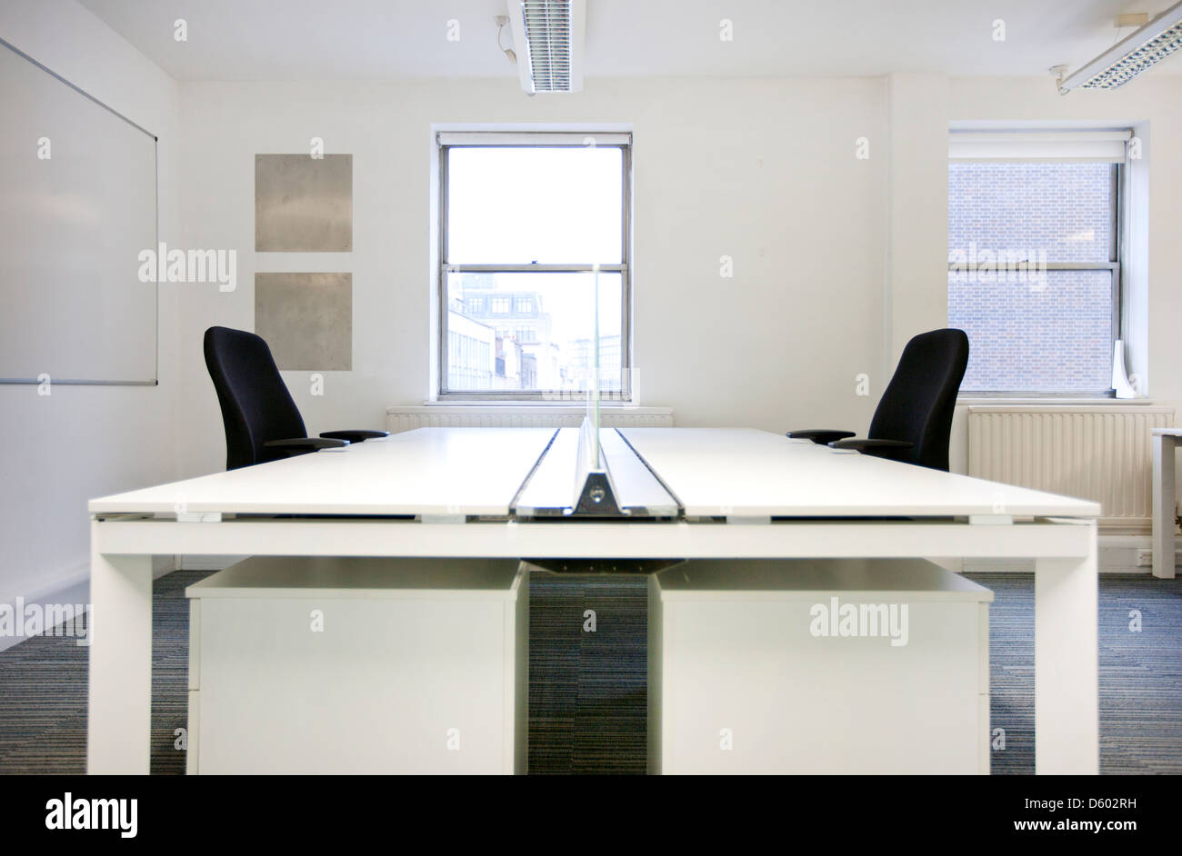 Empty office desks back back Stock Photo - Alamy