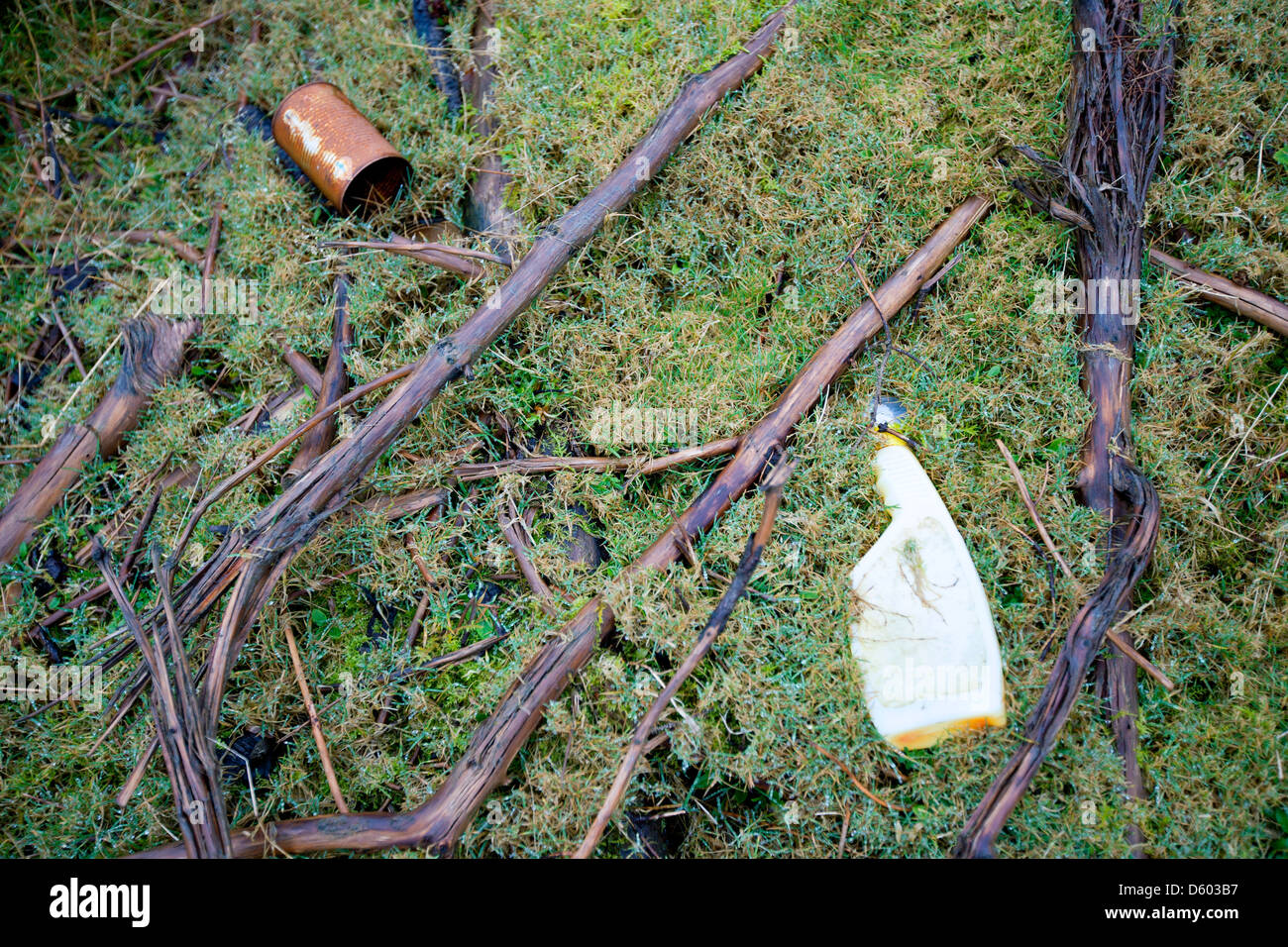 Weathered garbage embedded in ground Stock Photo - Alamy