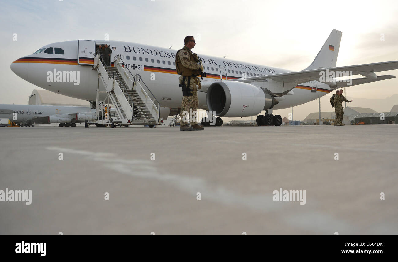 A soldier stands in front of an Airbus A-310 VIP after the arrival of ...