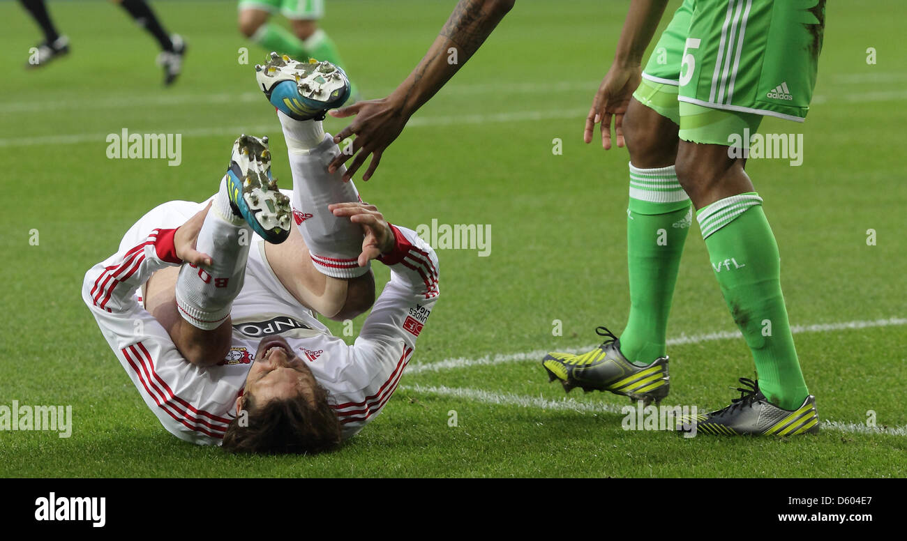 Leverkusen's Manuel Friedrich lies on the grass of the pitch during the ...