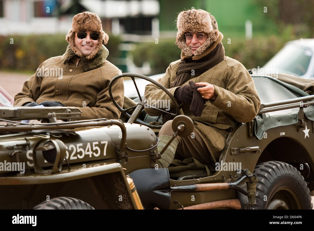 Two Rallye drivers are sitting in a Willys-Overland Willys-Jeep waiting ...